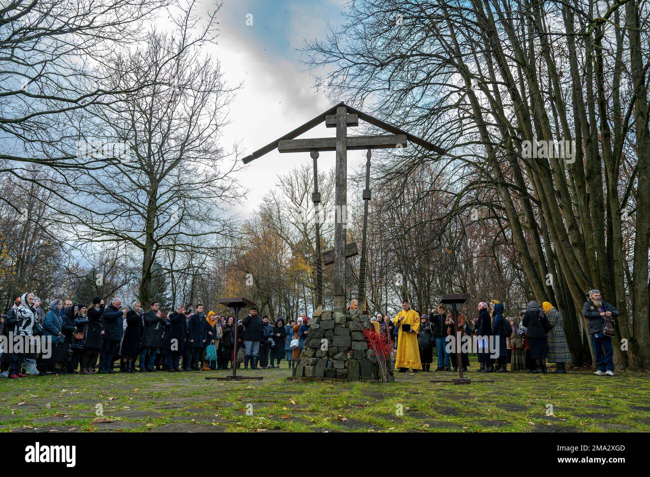 An Orthodox priest conducts a memorial service at the Garden of Memory ...