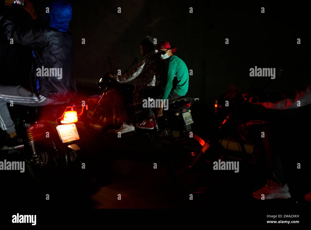 Motorcycles ride during a rally at night celebrating Halloween in ...