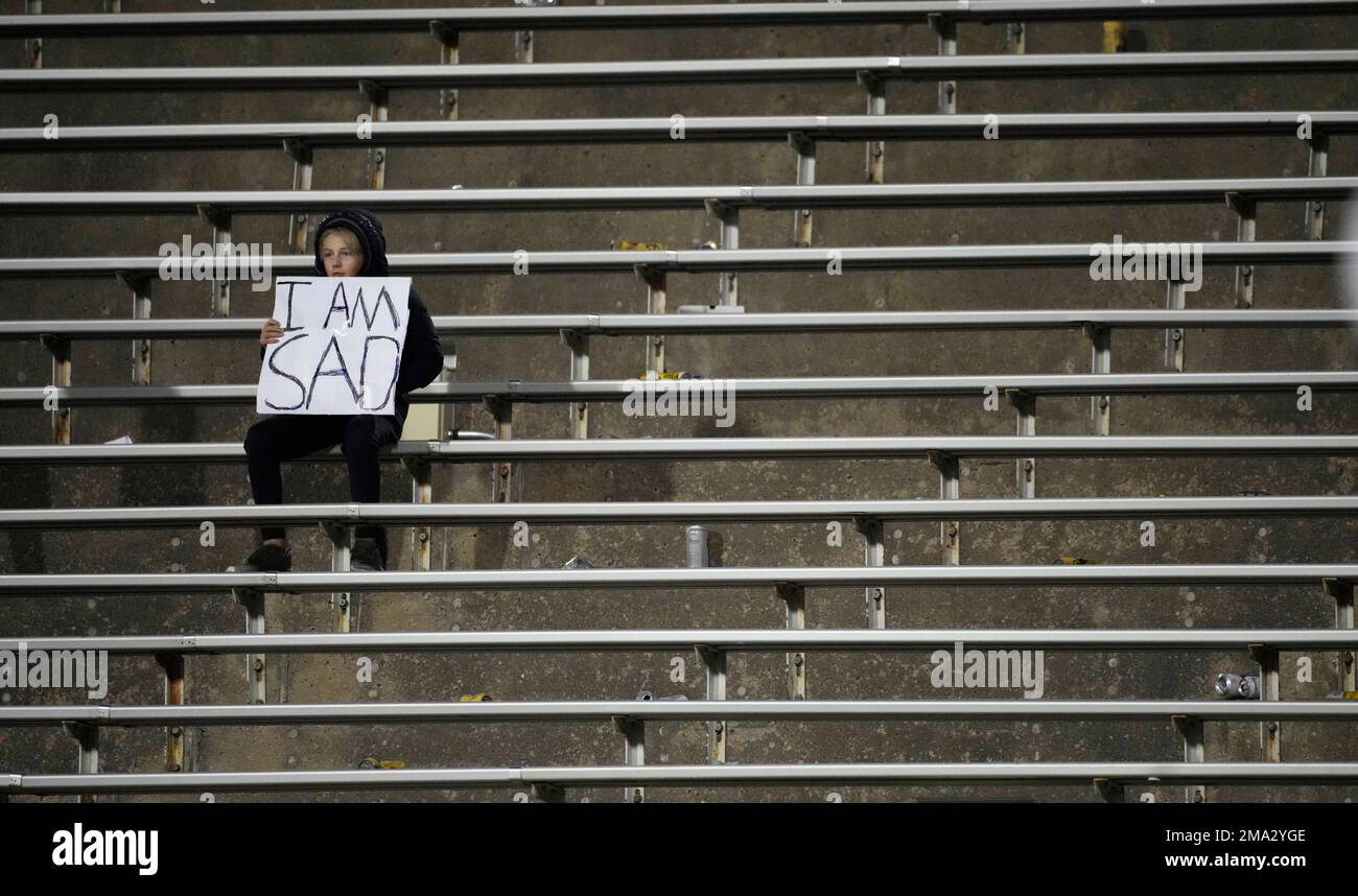 A lone fan sits in the empty student section late in the second half of ...