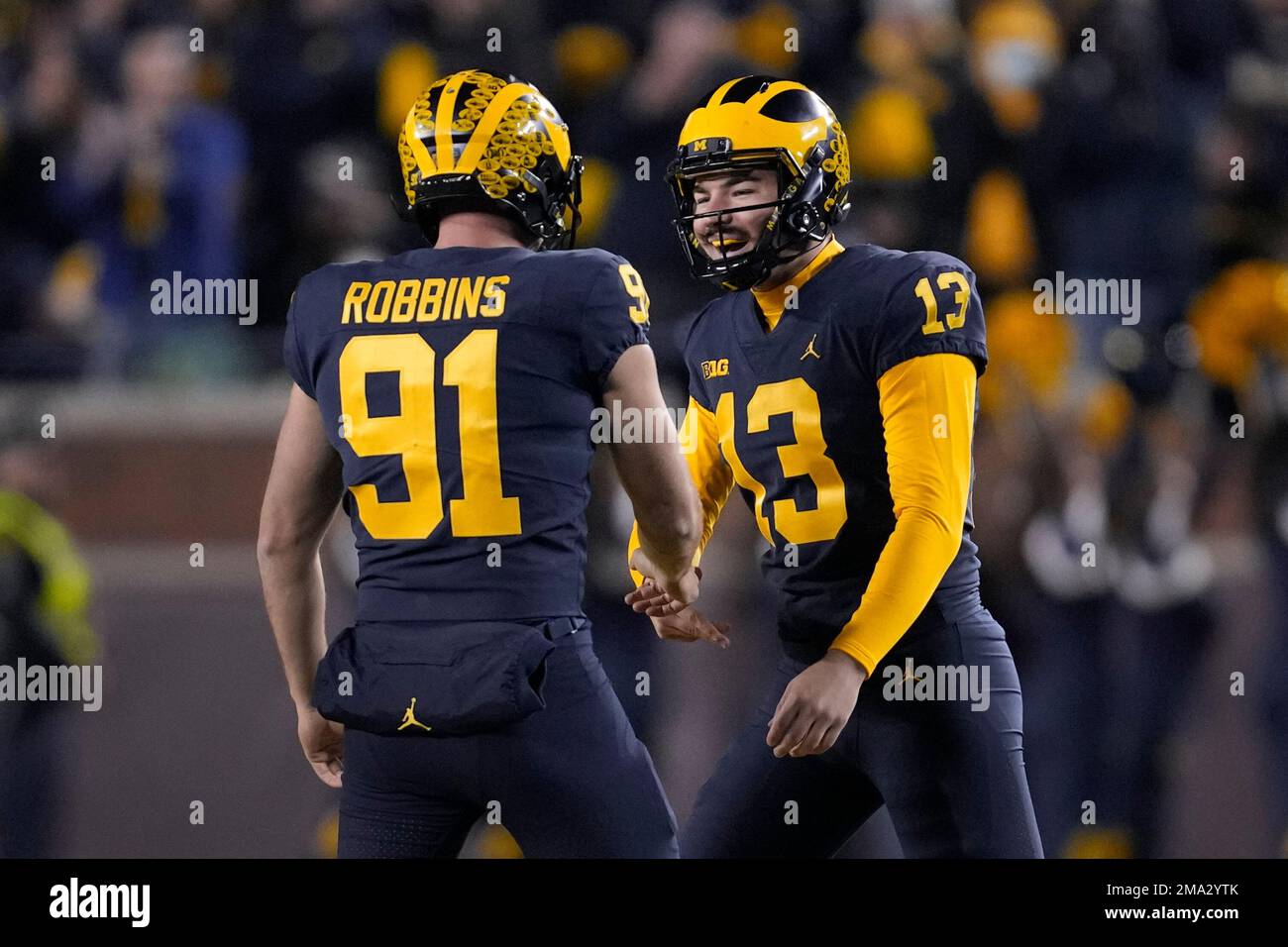 Michigan place kicker Jake Moody (13) celebrates his 54-yard field goal ...