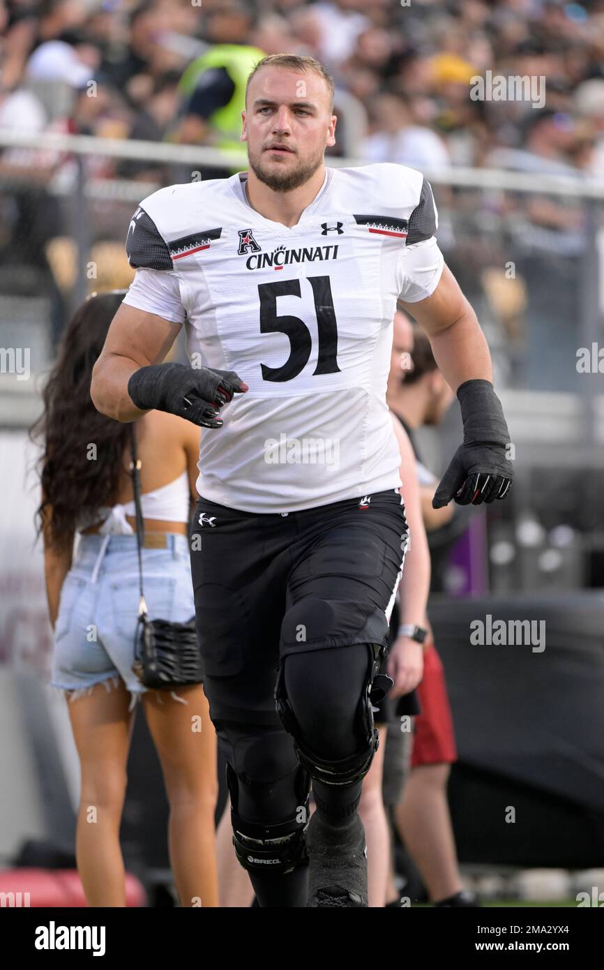 Cincinnati offensive lineman Lorenz Metz (51) jogs to the locker room ...