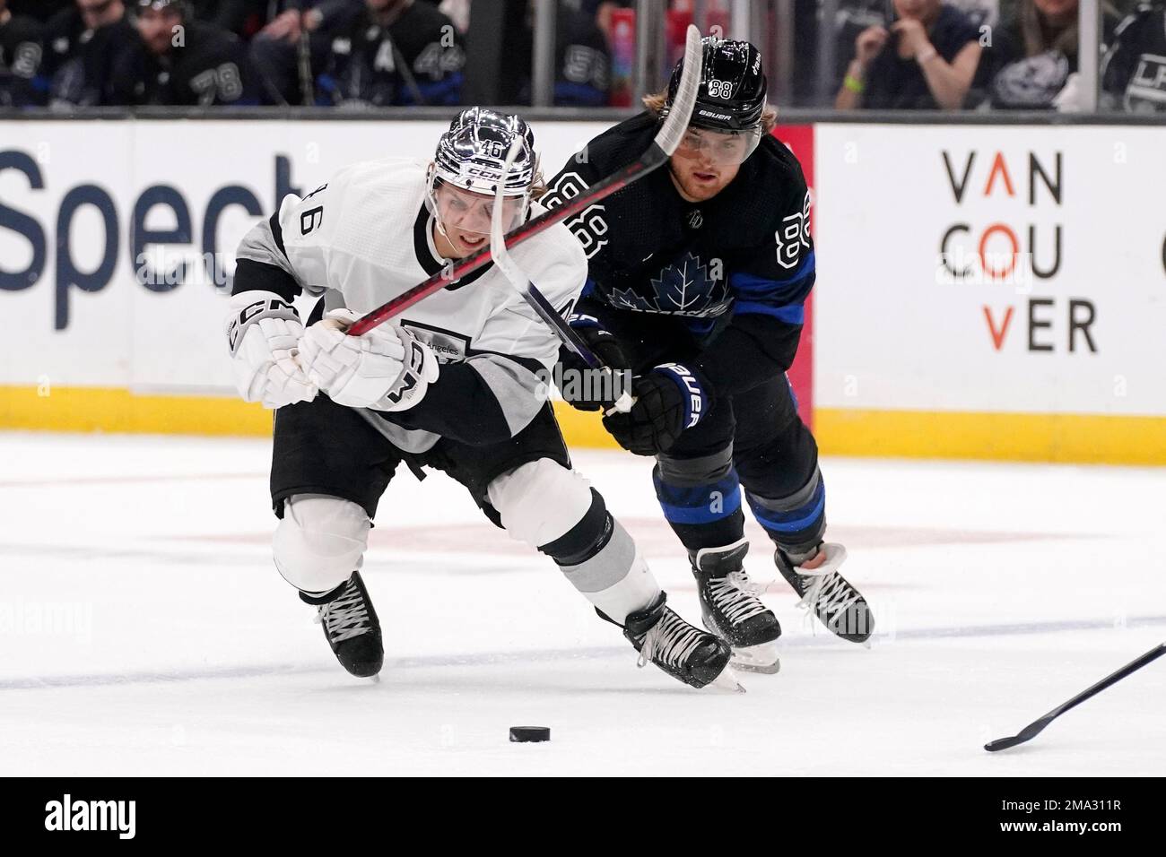 Los Angeles Kings center Blake Lizotte, left, and Toronto Maple Leafs ...