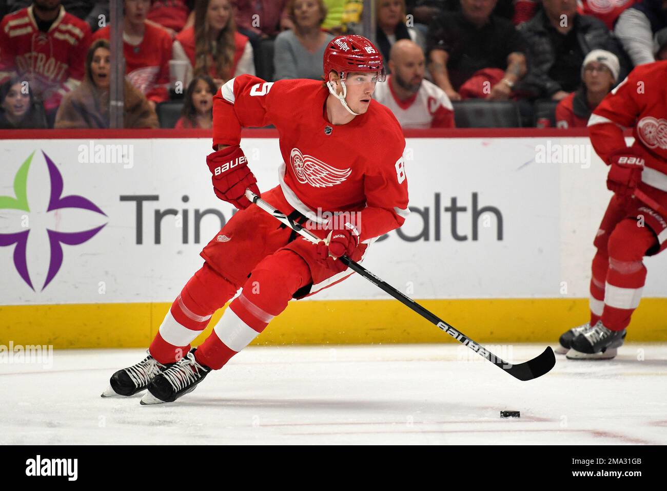 Detroit Red Wings left wing Elmer Soderblom skates with the puck ...