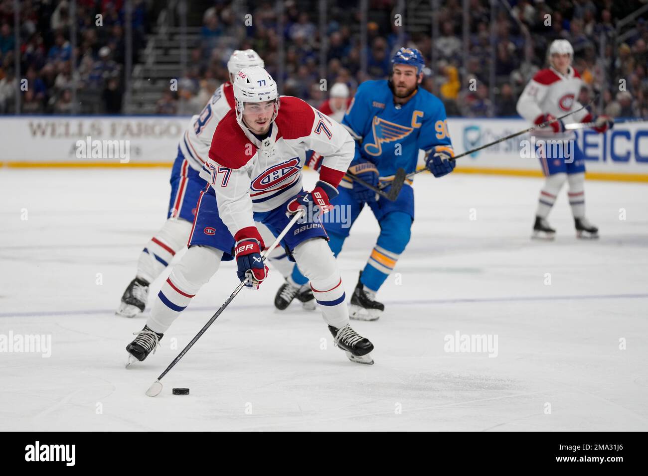 Montreal Canadiens' Kirby Dach (77) brings the puck down the ice during ...