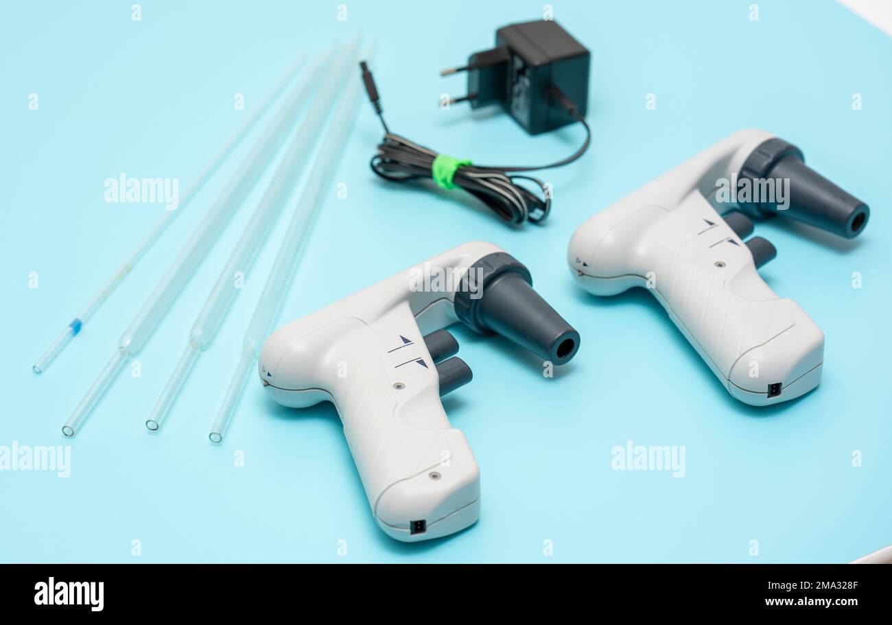 automatic electric pipette for scientific laboratory Stock Photo - Alamy