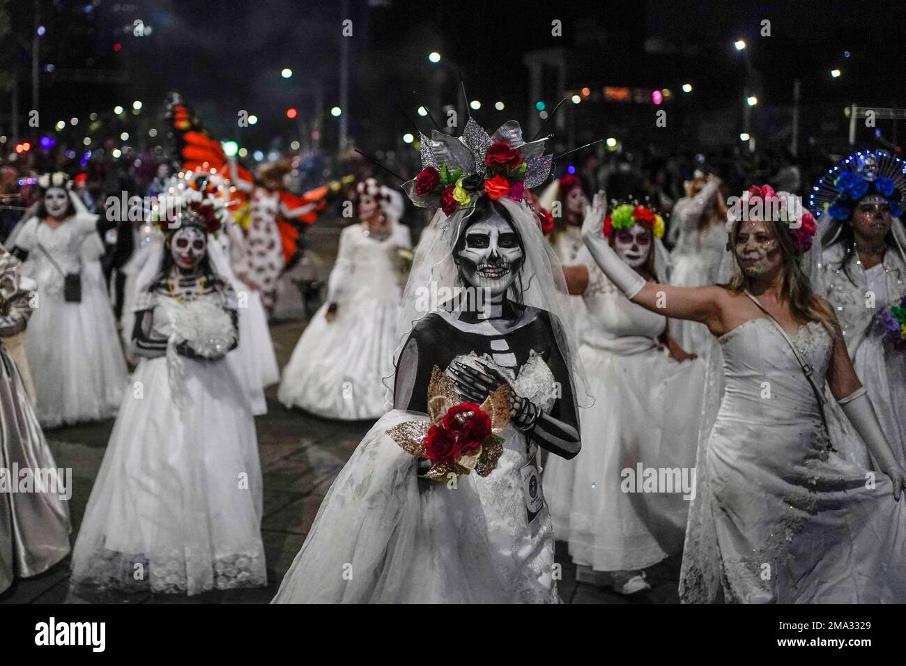 FILE - People dressed as Mexico's iconic "Catrinas" march in the Grand ...