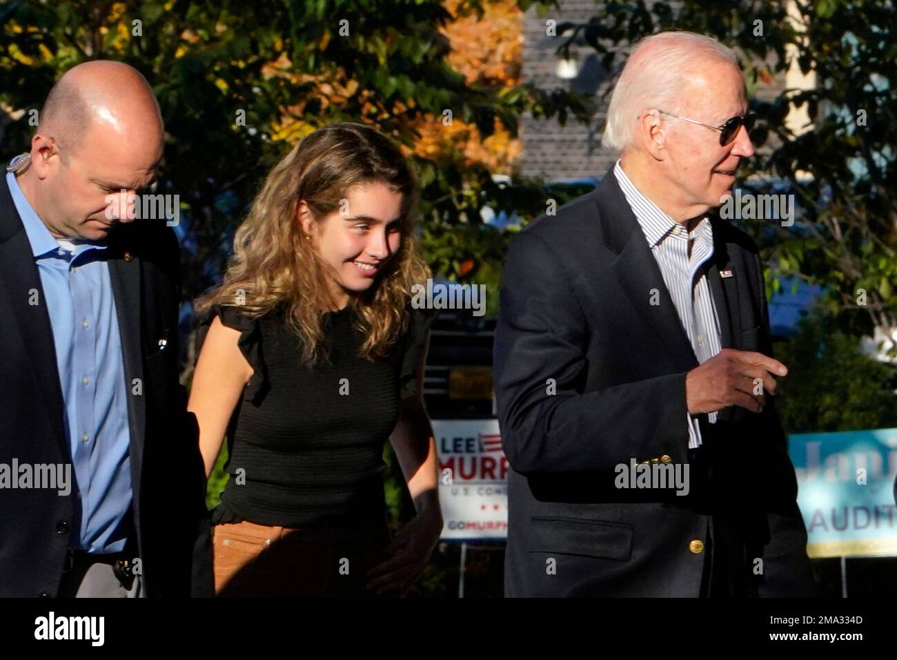 President Joe Biden arrives to vote with his granddaughter Natalie ...