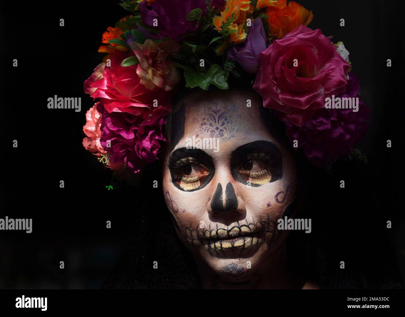 A woman dressed as Mexico's iconic "Catrina" poses for tourists in ...