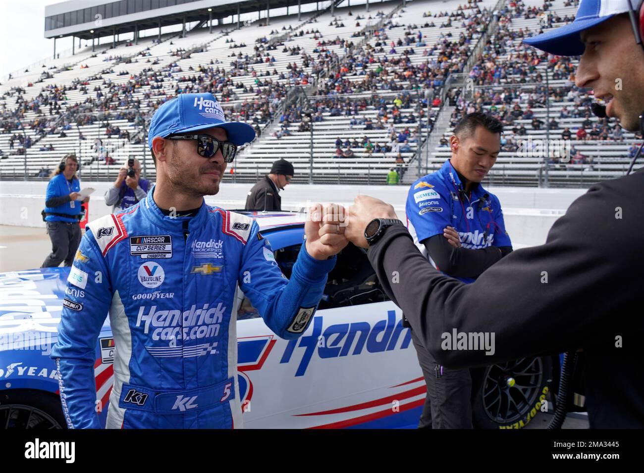 Kyle Larson, left, is congratulated after winning the pole position for ...