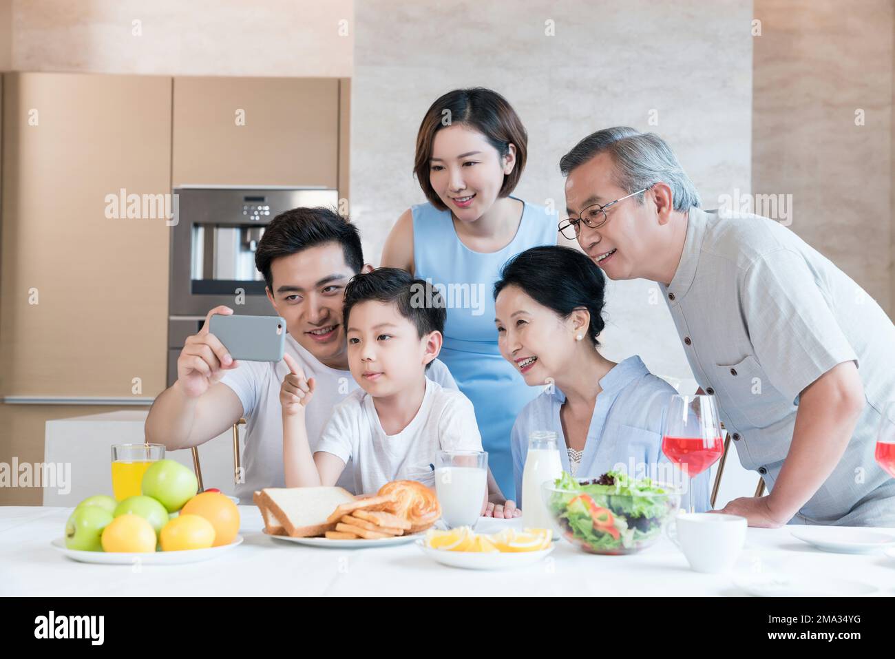 Happy family meals Stock Photo - Alamy