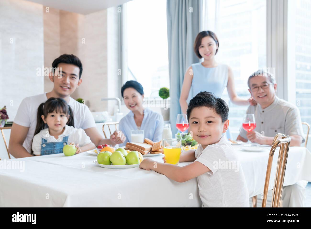 Happy family dinner party Stock Photo - Alamy