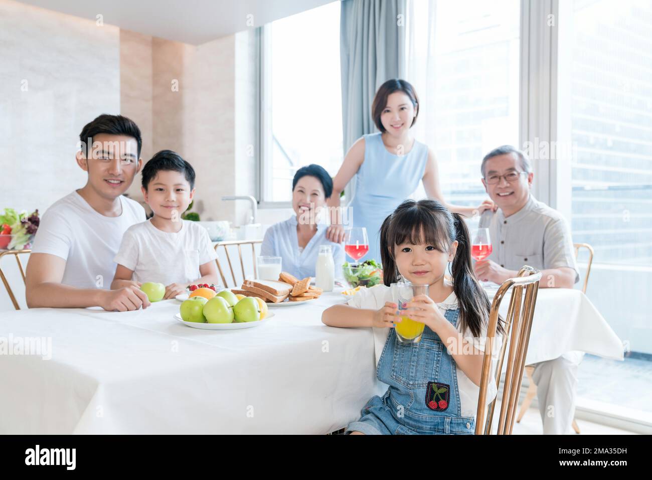 Happy family dinner party Stock Photo - Alamy