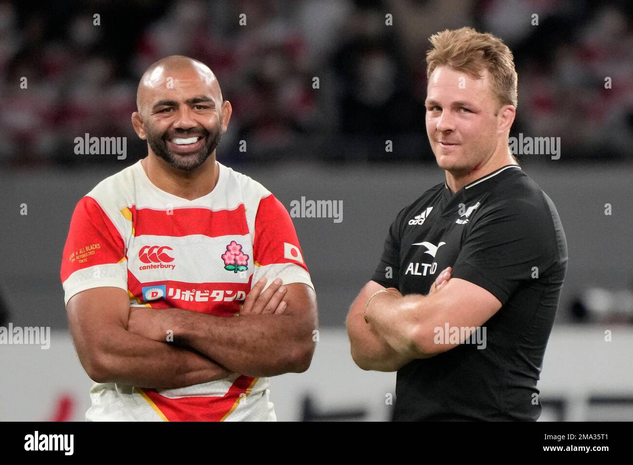 New Zealand's captain Sam Cane, right, and Japan's captain Michael ...