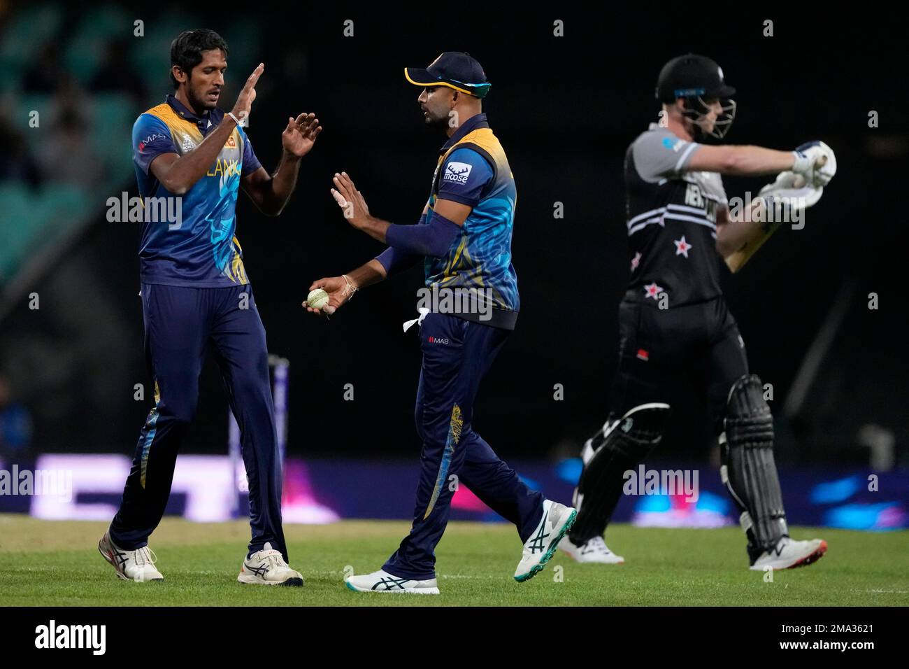 Sri Lanka's Kasun Rajitha, left, celebrates taking the wicket of New ...