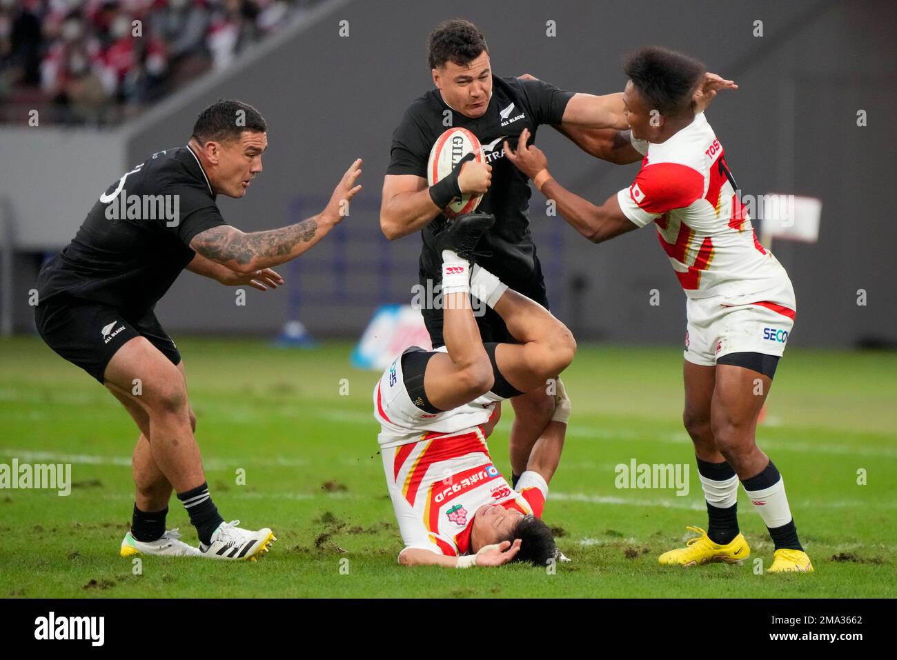New Zealand's David Havili attempts to break a tackle during the rugby ...