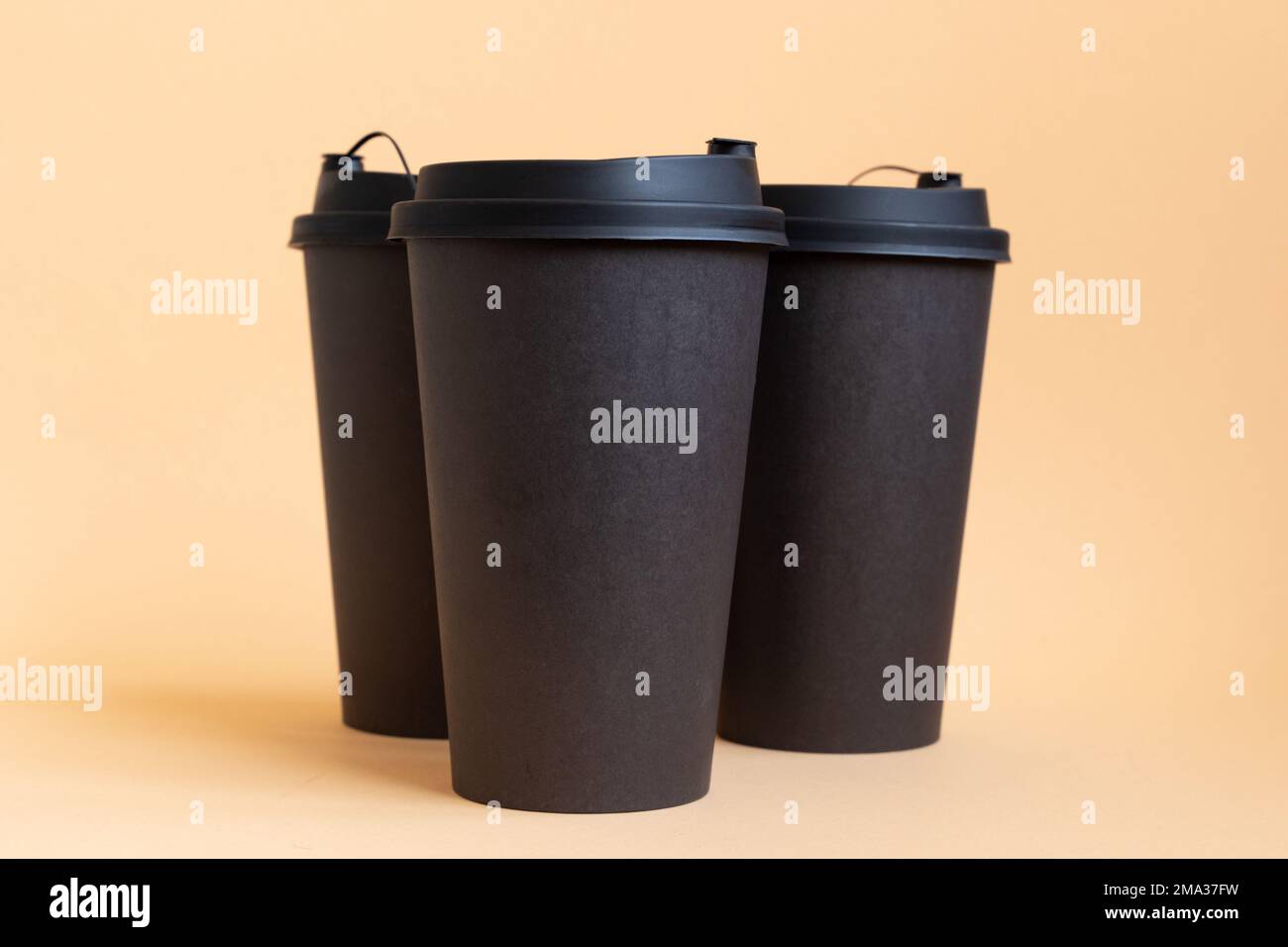 Set of three takeaway black coffee cup on neutral background. Mock -up ...