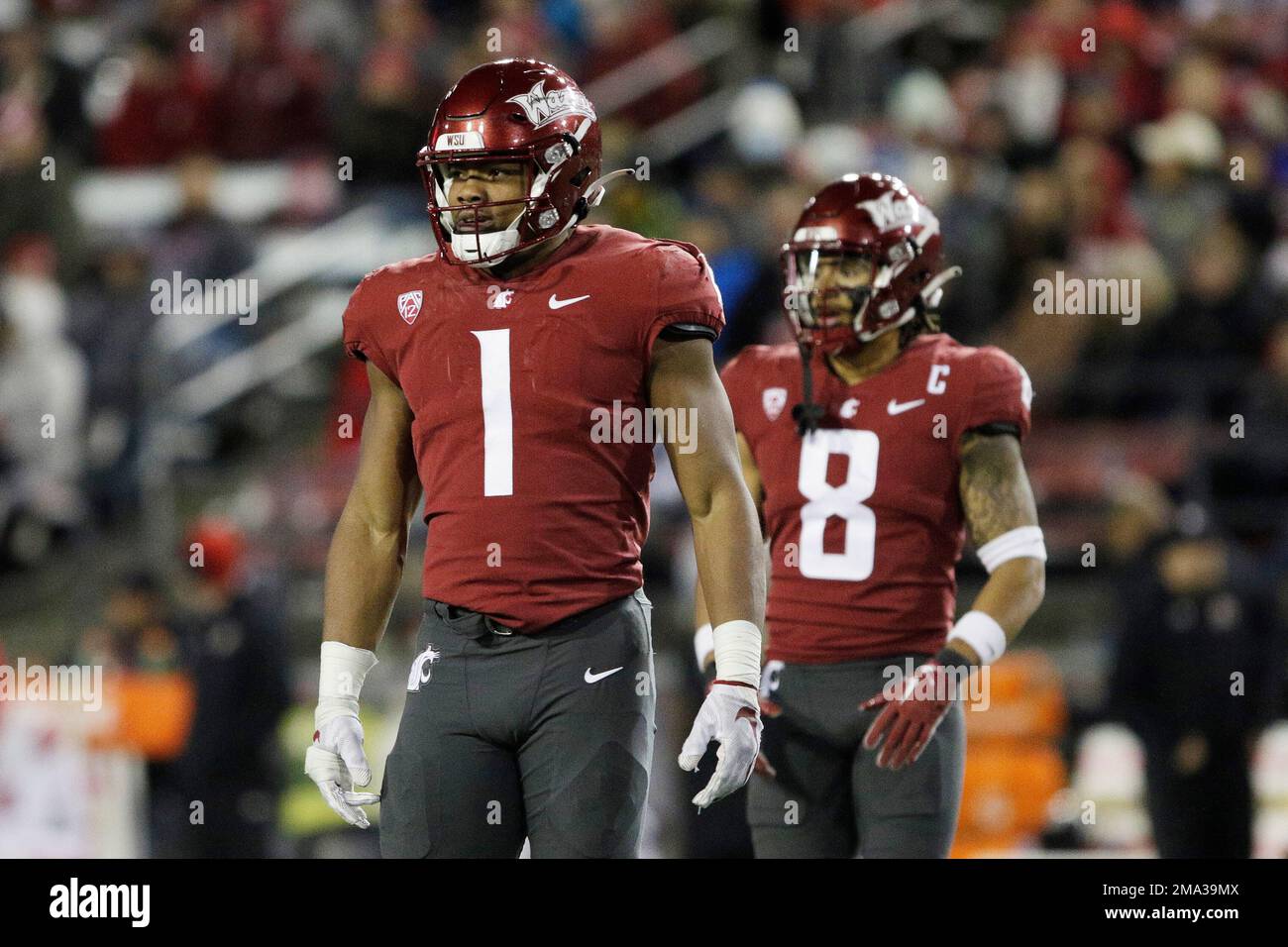 Washington State linebacker Daiyan Henley (1) and defensive back Armani ...