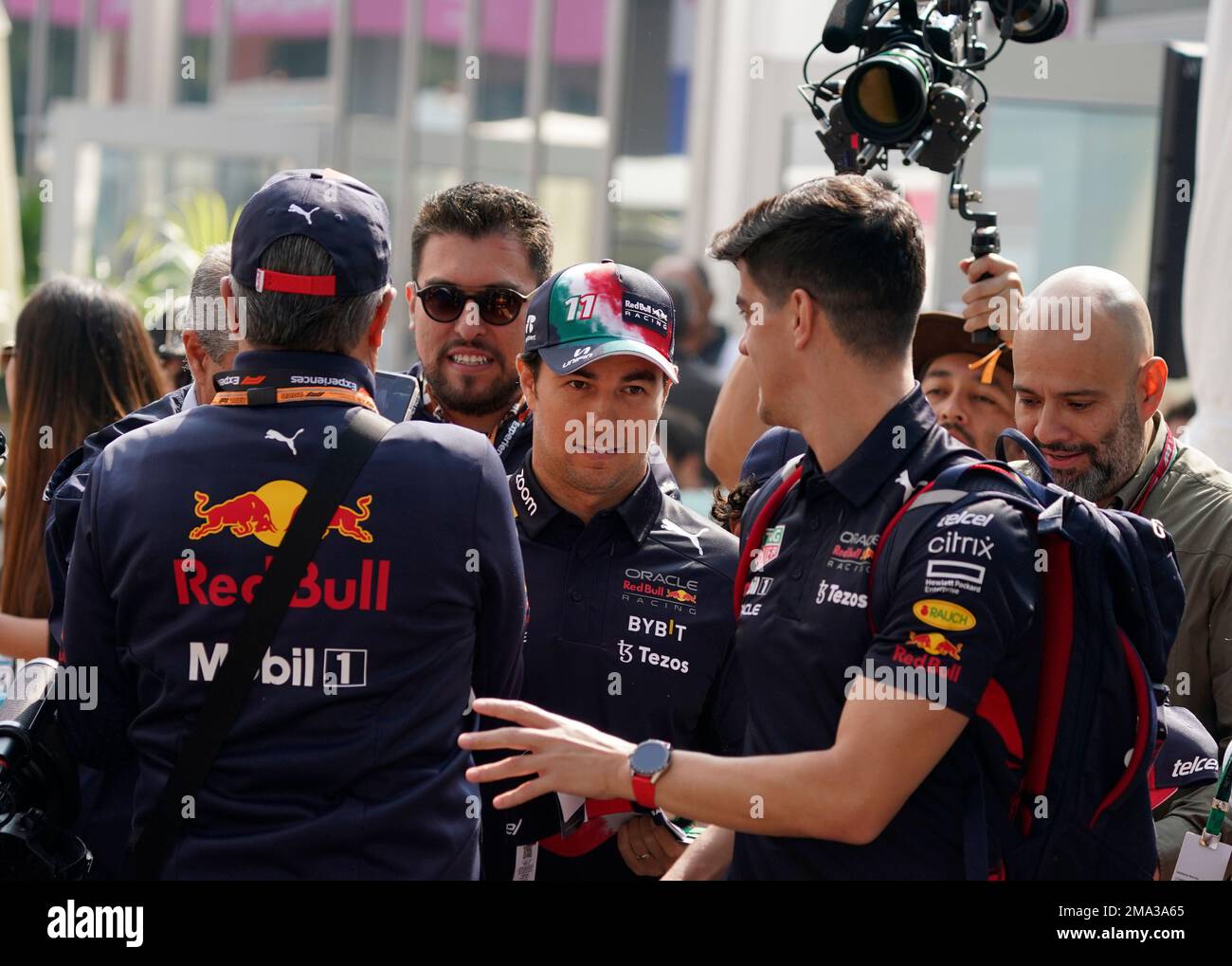 Red Bull driver Sergio Perez, of Mexico, arrives at the paddock of the ...