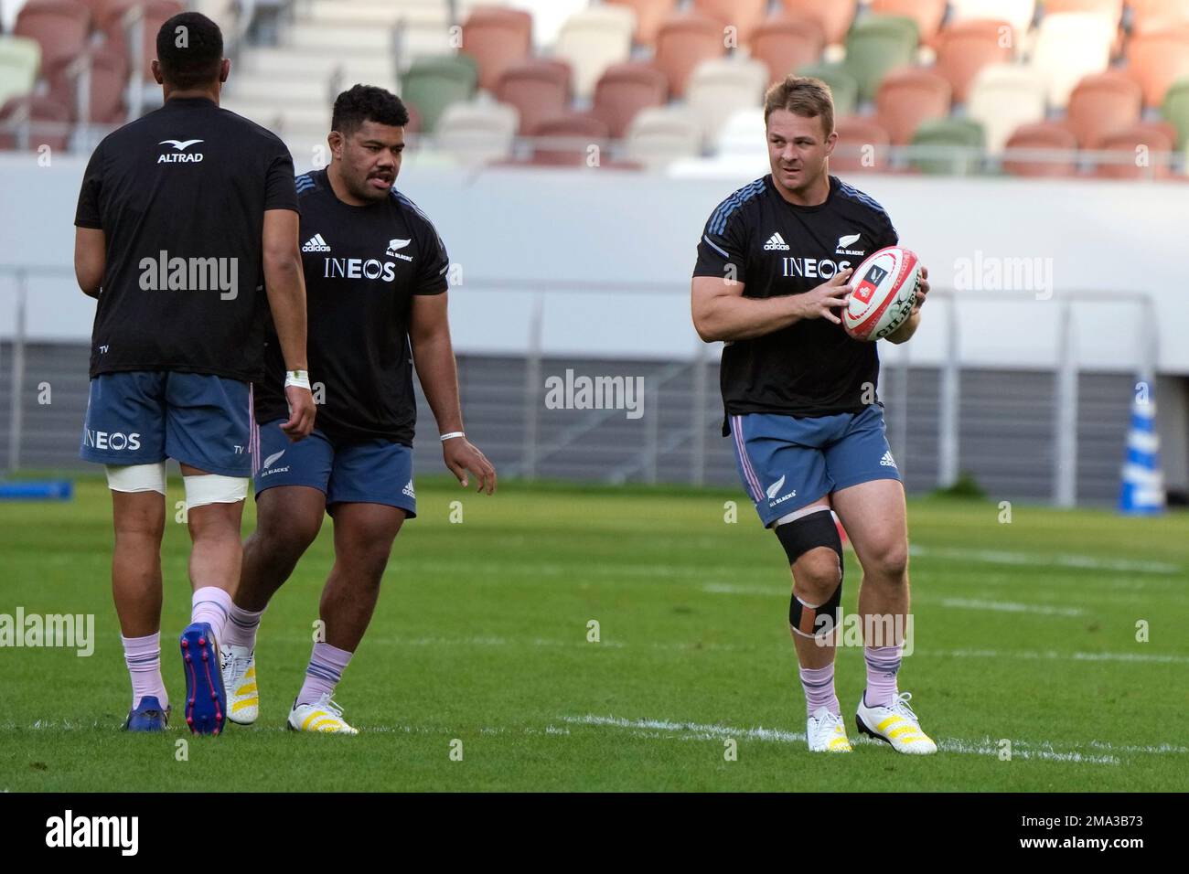 New Zealand's captain Sam Cane, right, warms up during the All Blacks ...