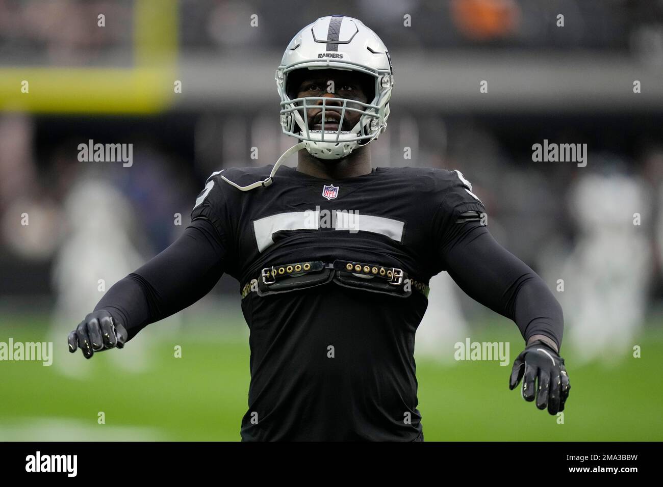 Las Vegas Raiders defensive end Chandler Jones (55) warms up before an ...