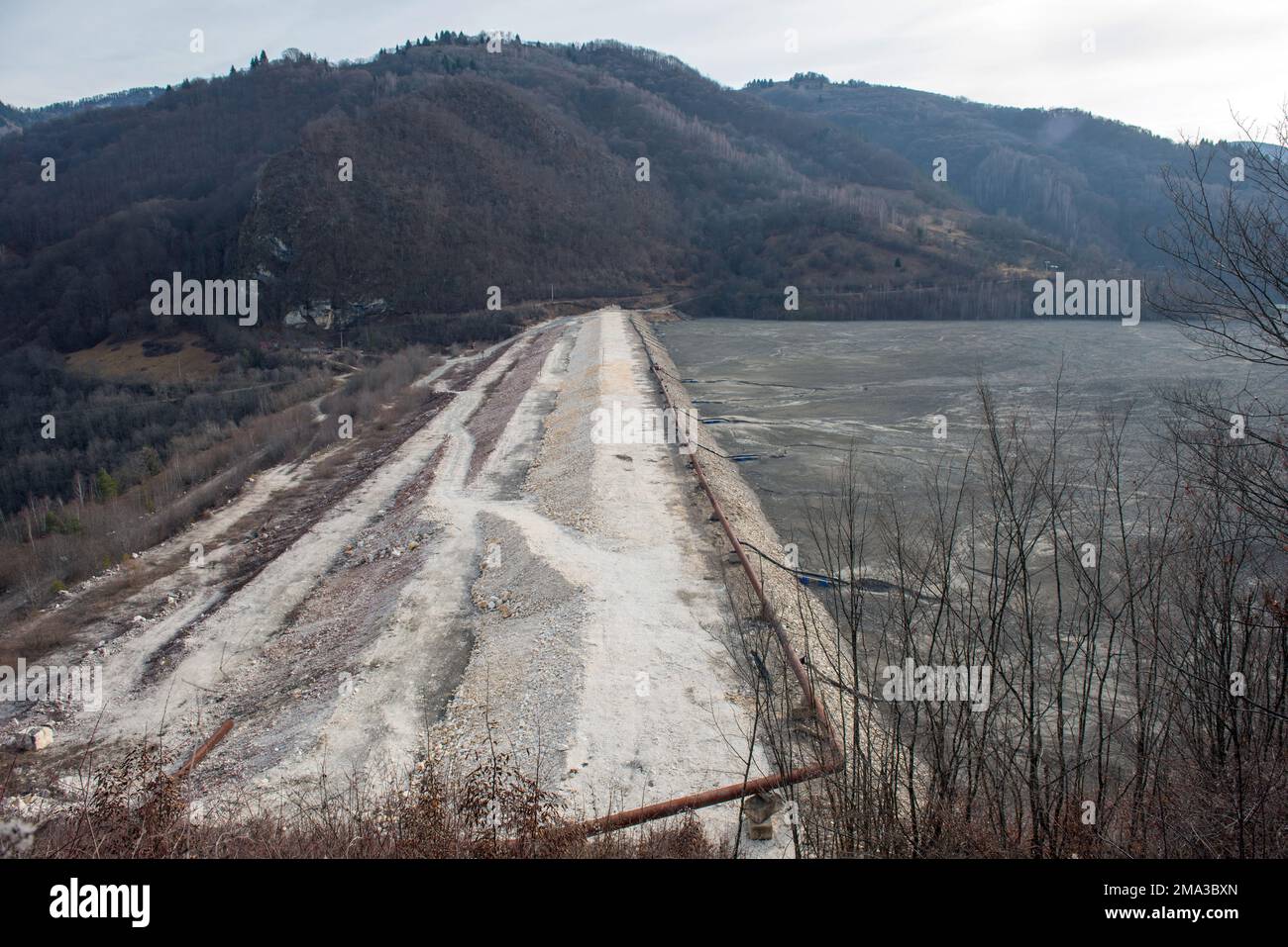 Barrier stopping the flow of copper and gold mining mining residuals ...