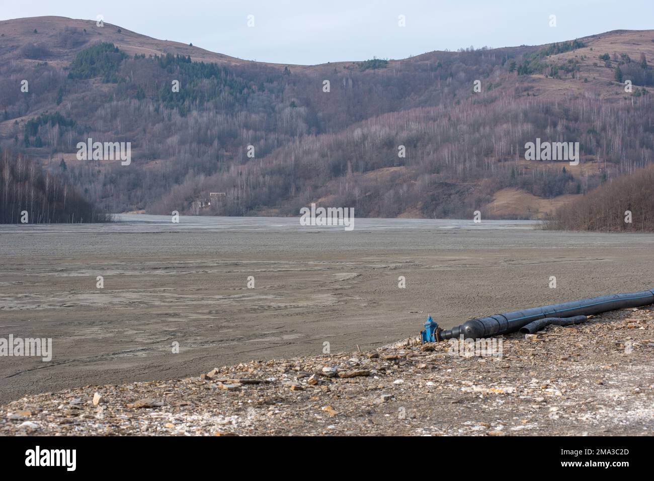 Decanting lake pipe installation treatment with lime and gypsum for ...