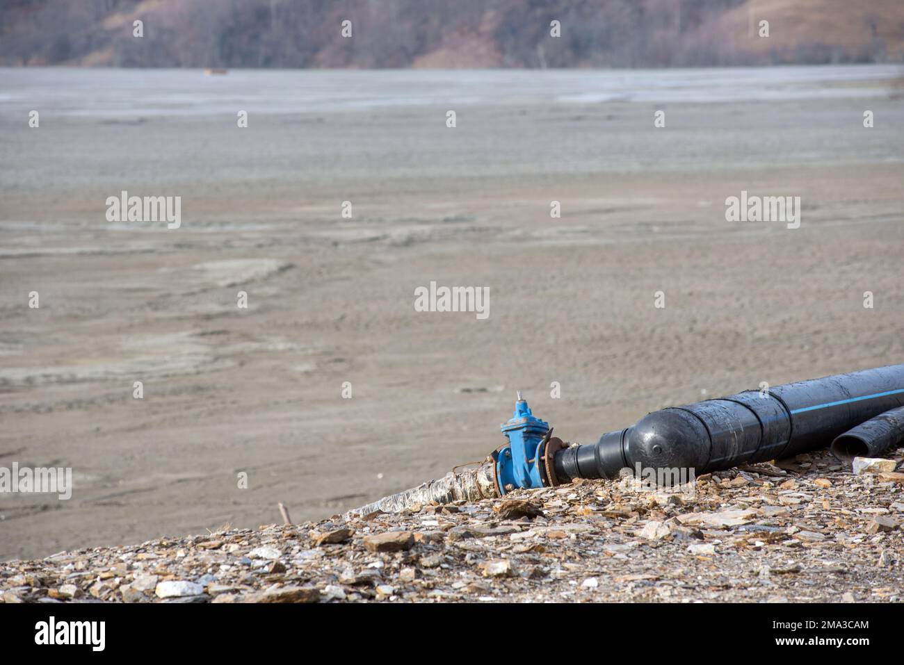 Decanting lake pipe installation treatment with lime and gypsum for ...