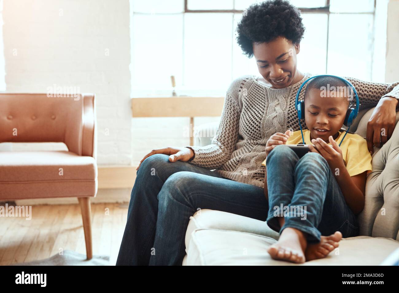 Tablet, relax and black family of child, mother or African people relax ...