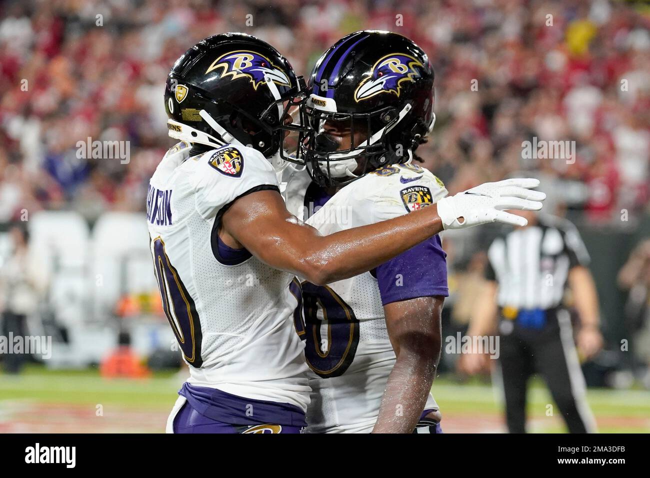 Baltimore Ravens tight end Isaiah Likely, right, is congratulated by ...