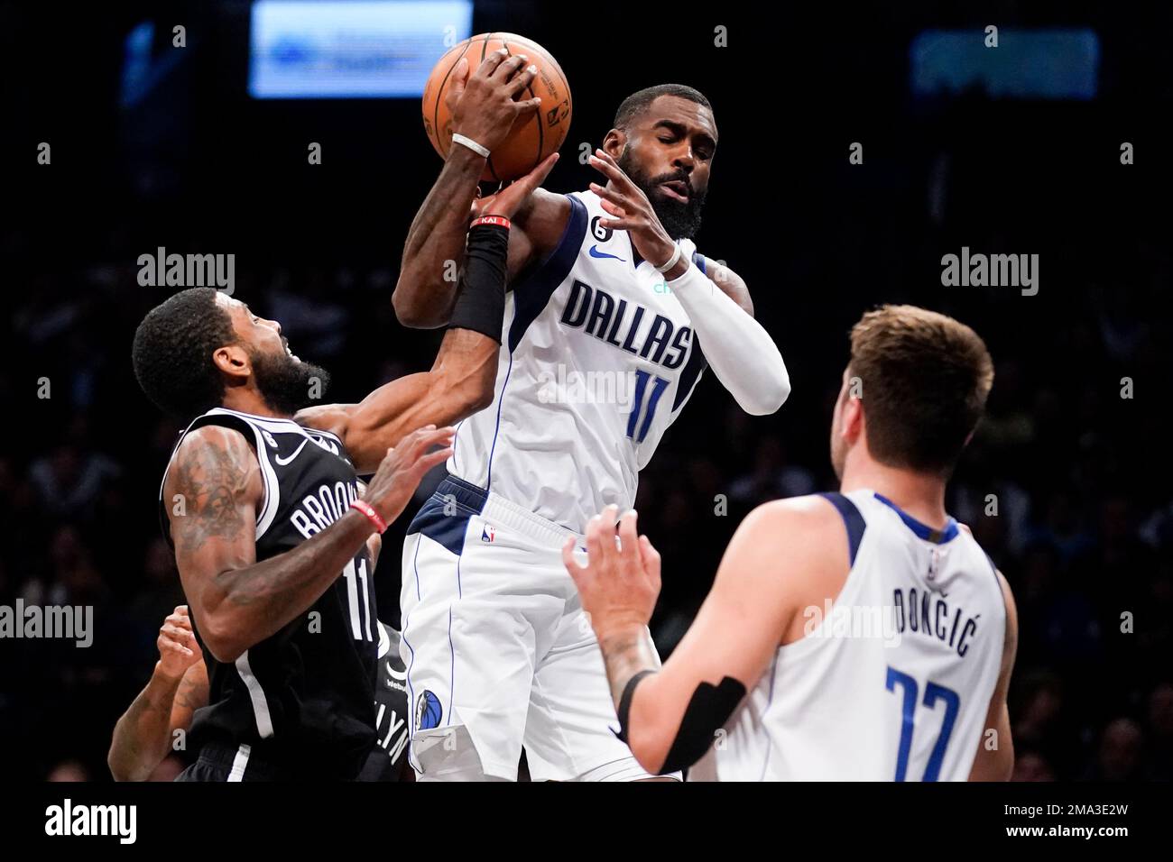 Brooklyn Nets guard Kyrie Irving (11) blocks a shot by Dallas Mavericks ...