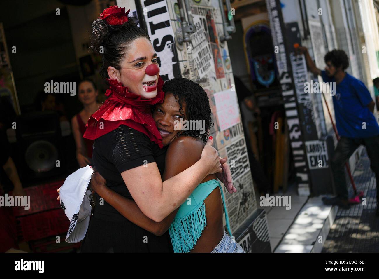 Andrea Macera, known as her clown character Mafalda, hugs a ...