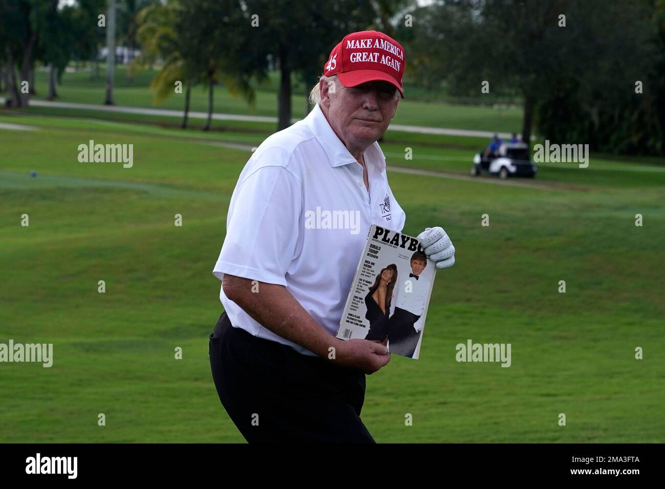 Donald Trump holds an old Playboy magazine with him on the cover, given ...