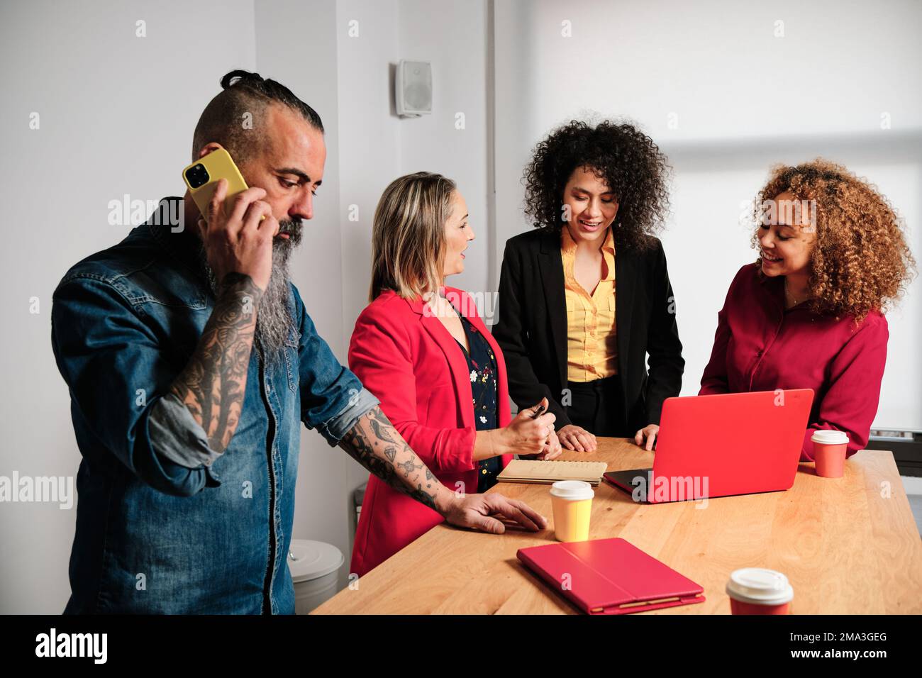 Man talking on the phone while working in the coworking office Stock ...