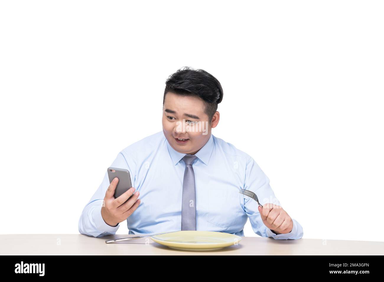 Fat people see mobile phone when you eat Stock Photo - Alamy