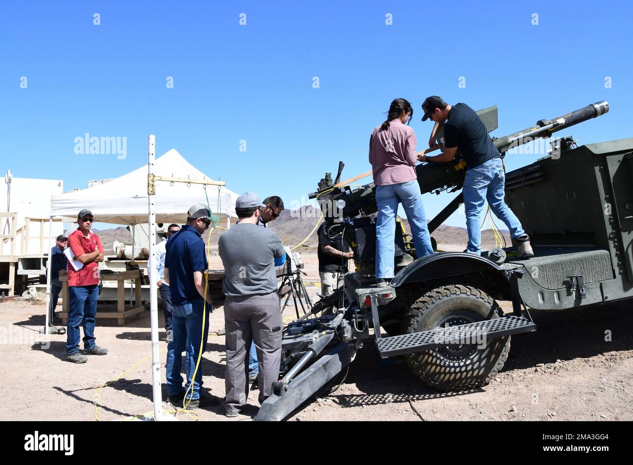 The crew at the gun position checks the weapons system prior to firing ...