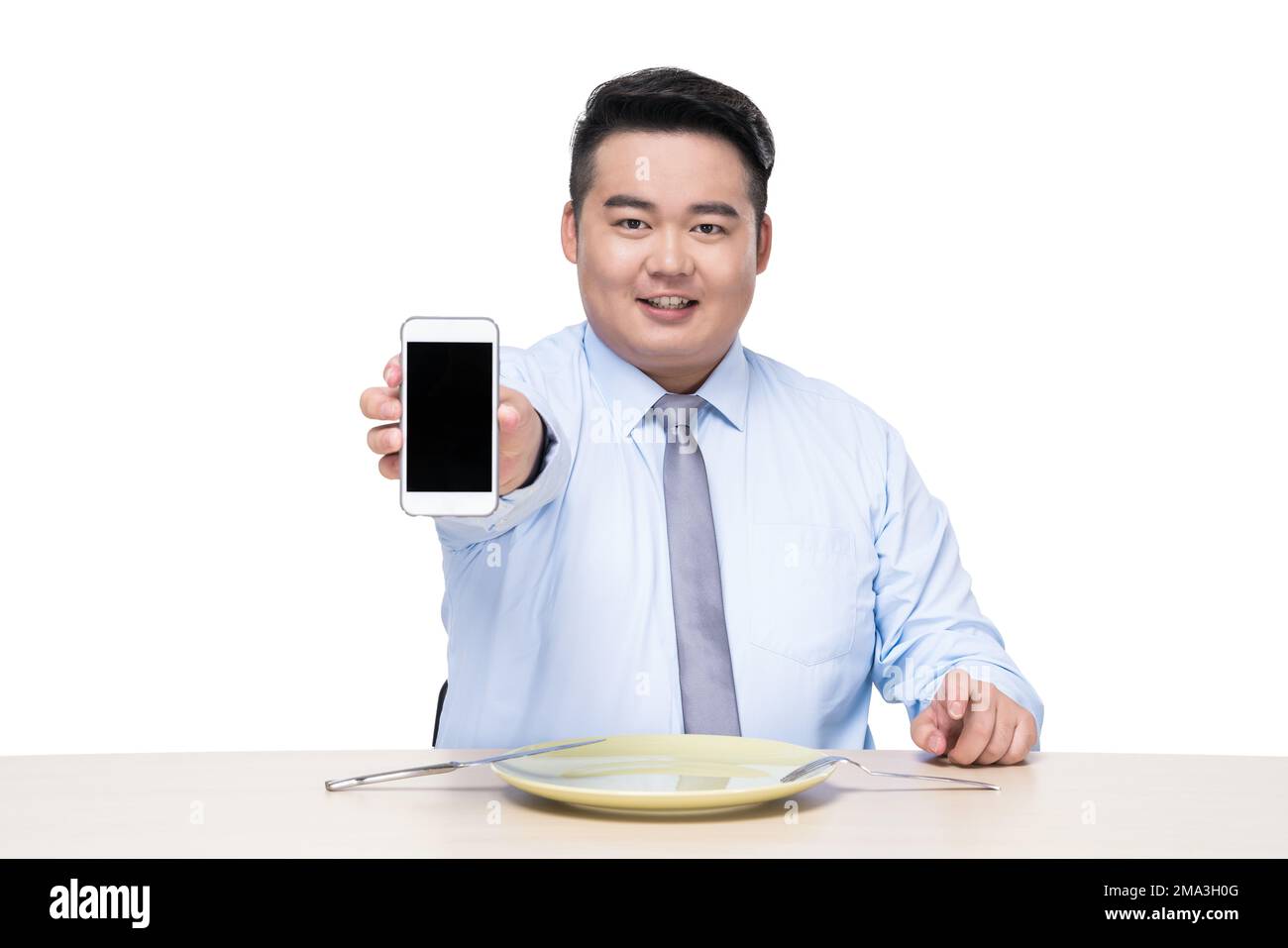 Fat people see mobile phone when you eat Stock Photo - Alamy