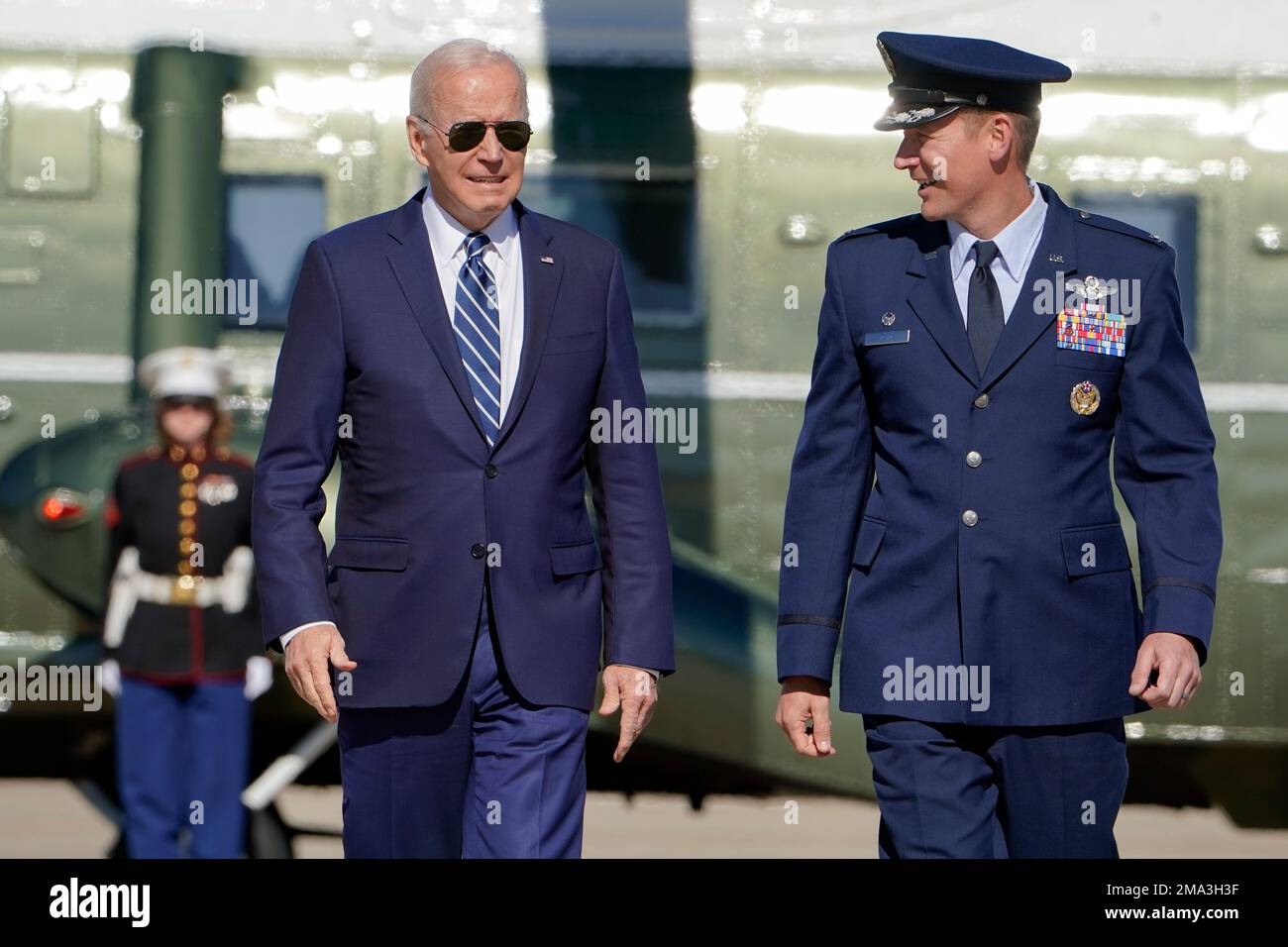 President Joe Biden is escorted by Col. Gregory Adams, Commander of the 89th Operations Group ...