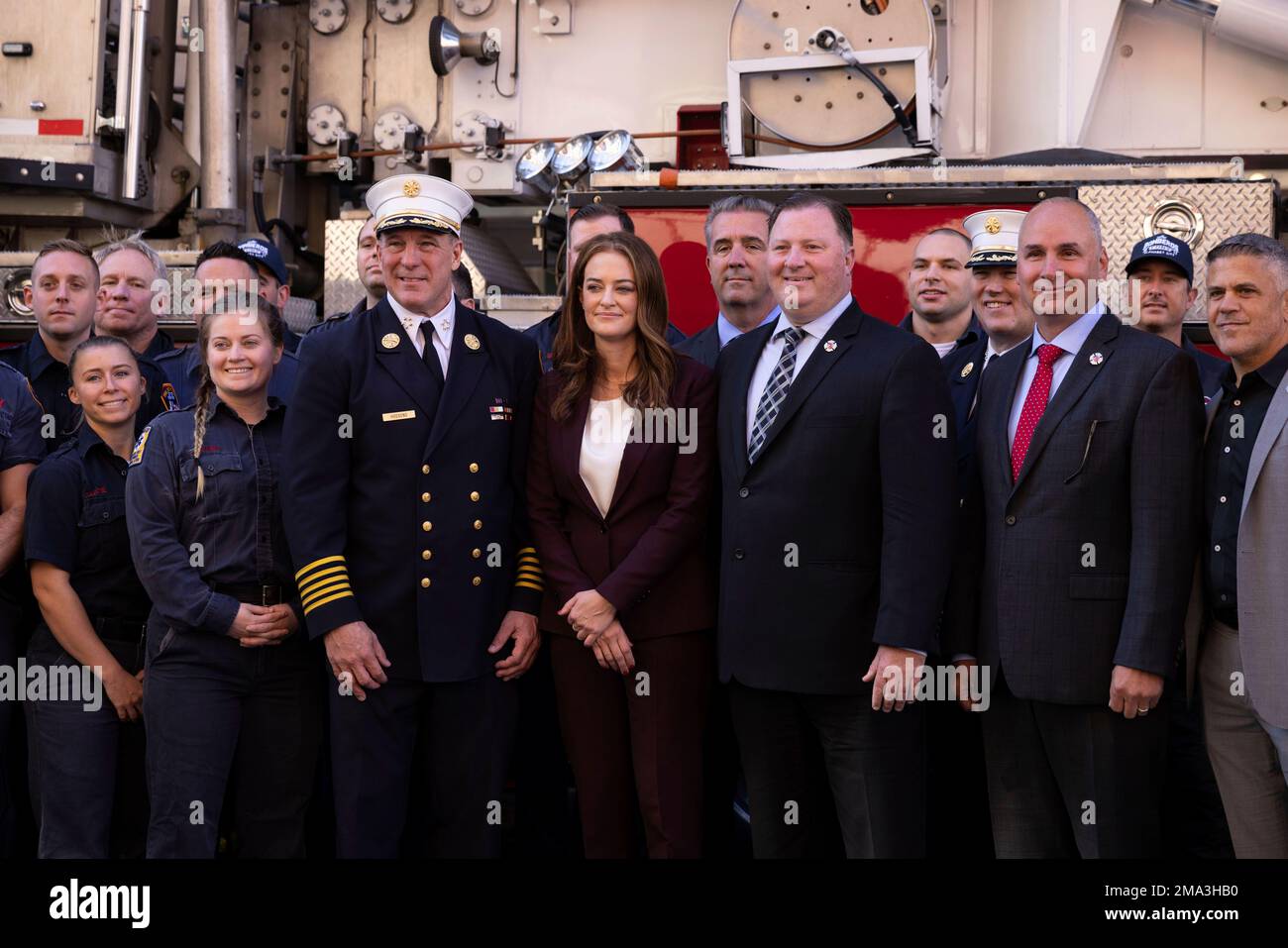Laura Kavanagh poses for a photo with the members of FDNY after taking ...