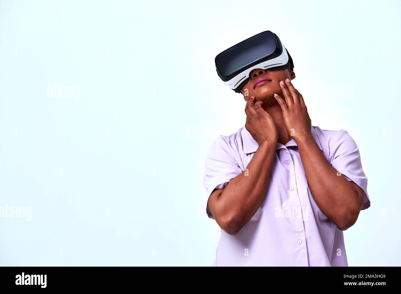 A Cheerful African American Girl In Virtual Reality Of Glasses Enjoys Viewing Verbal Reality