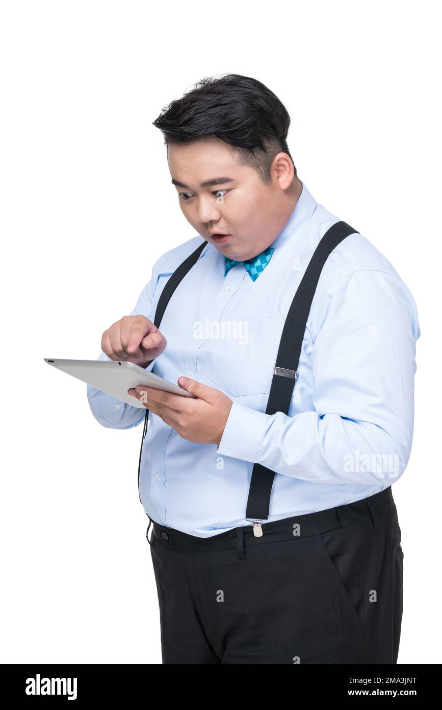 Take a tablet of obese young men Stock Photo - Alamy