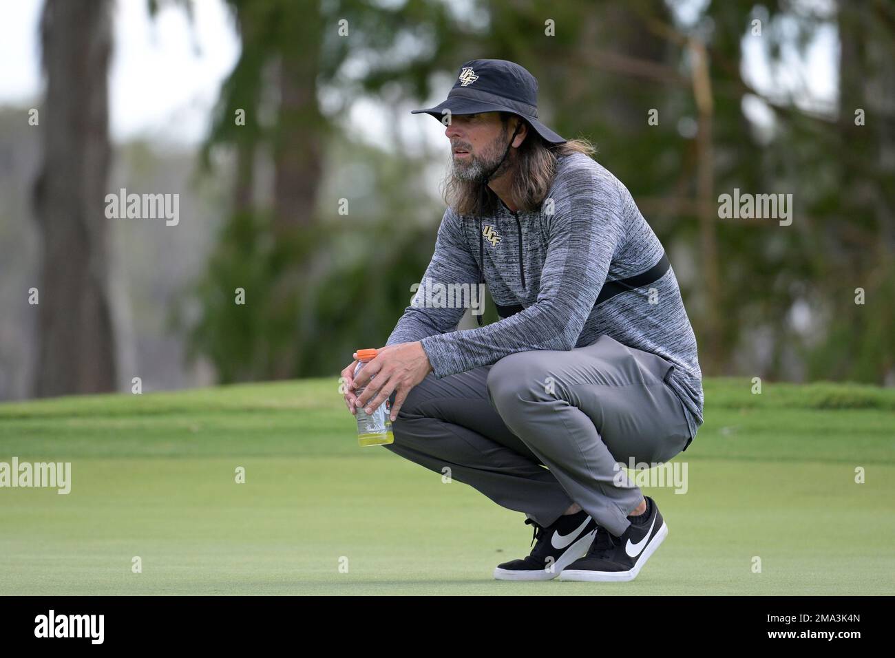 Central Florida men's head golf coach Bryce Wallor watches on the 17th ...