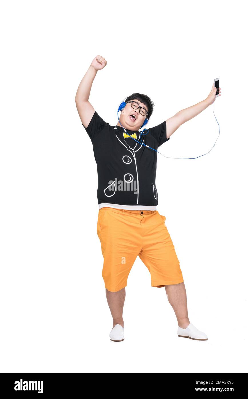 Fat young men listen to music Stock Photo - Alamy