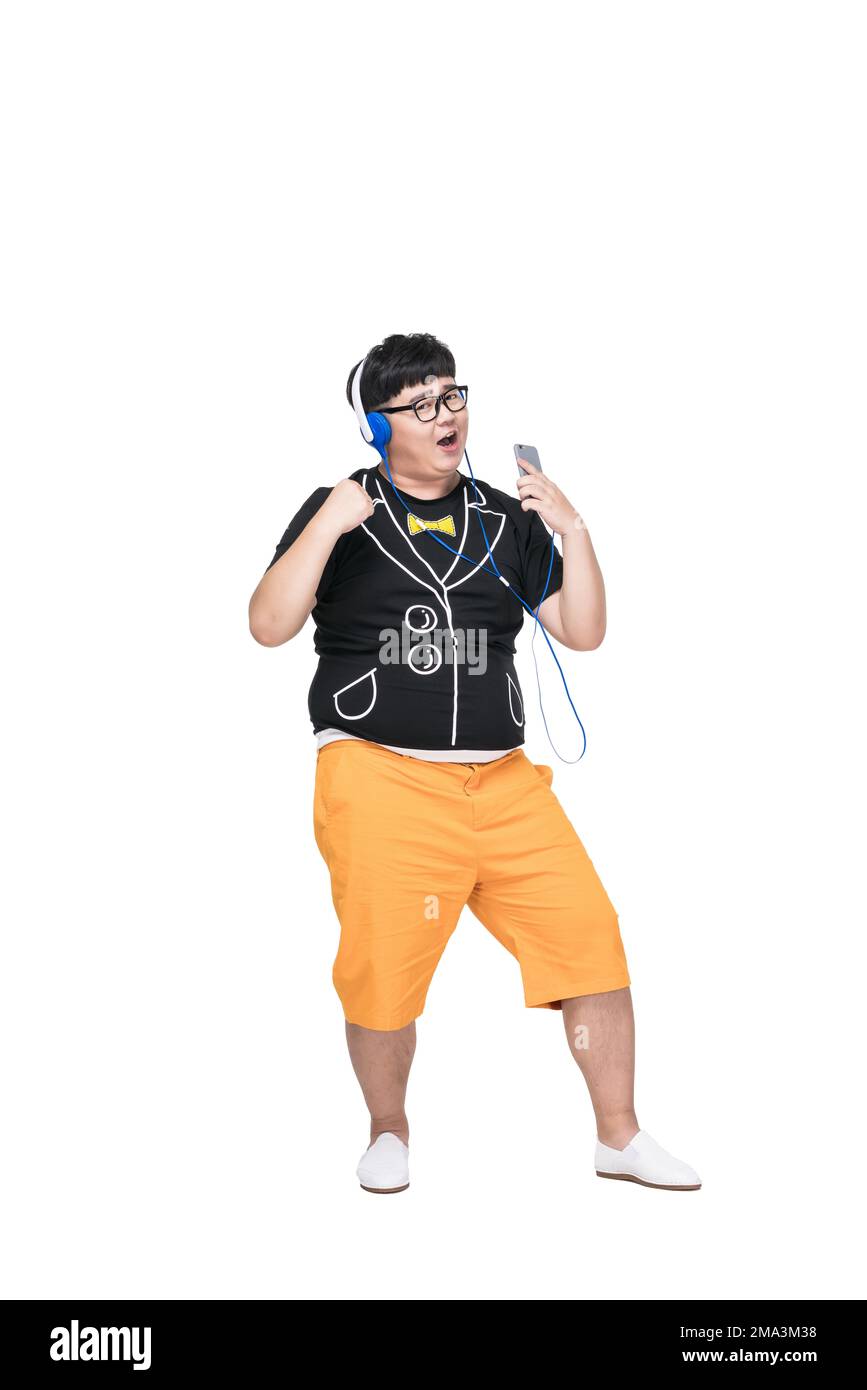 Fat young men listen to music Stock Photo - Alamy