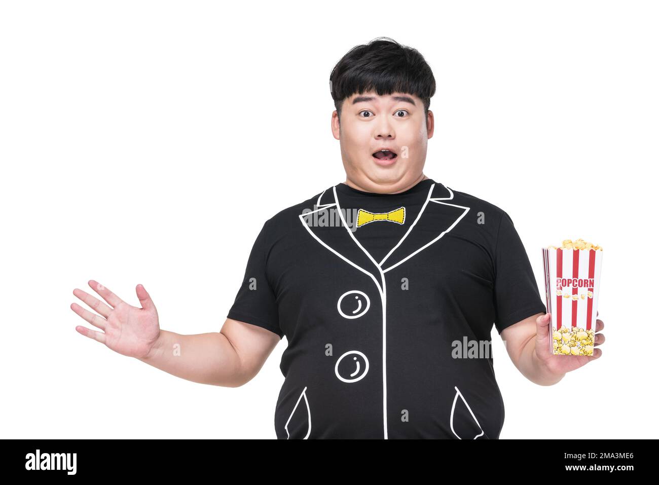 Take the fat young men popcorn Stock Photo - Alamy