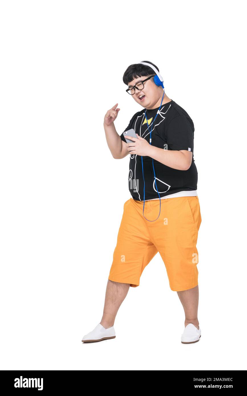 Fat young men listen to music Stock Photo - Alamy