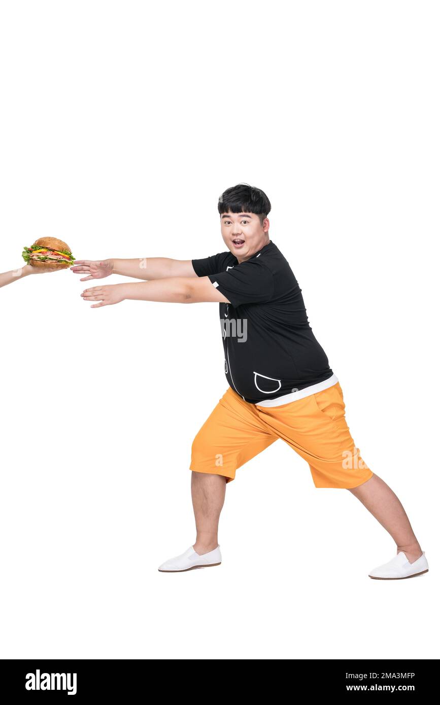 Obese young man fell on the food Stock Photo - Alamy