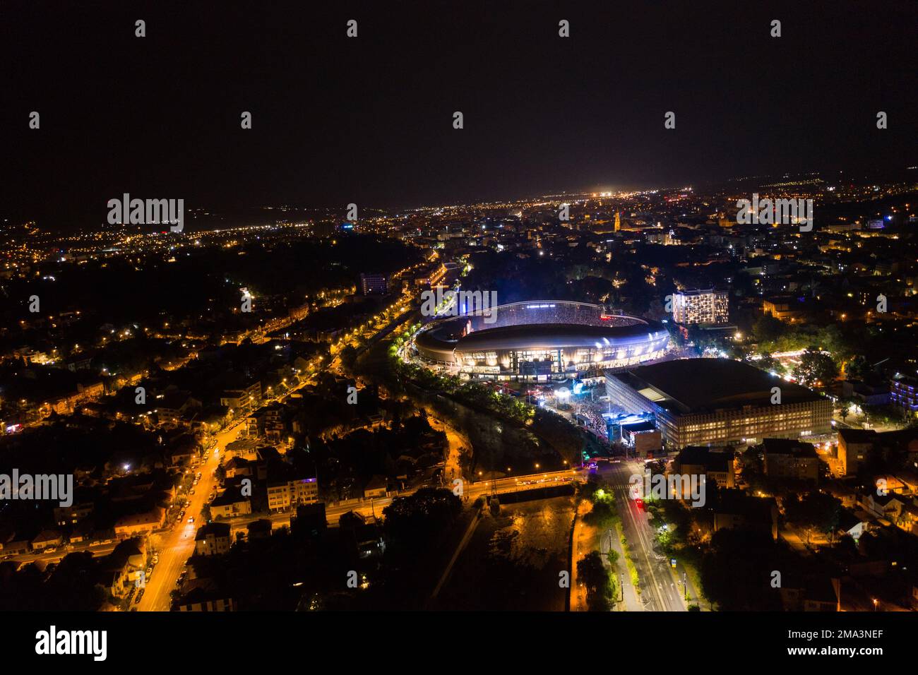 Aerial view of Cluj Napoca city by night. Urban landscape with ...