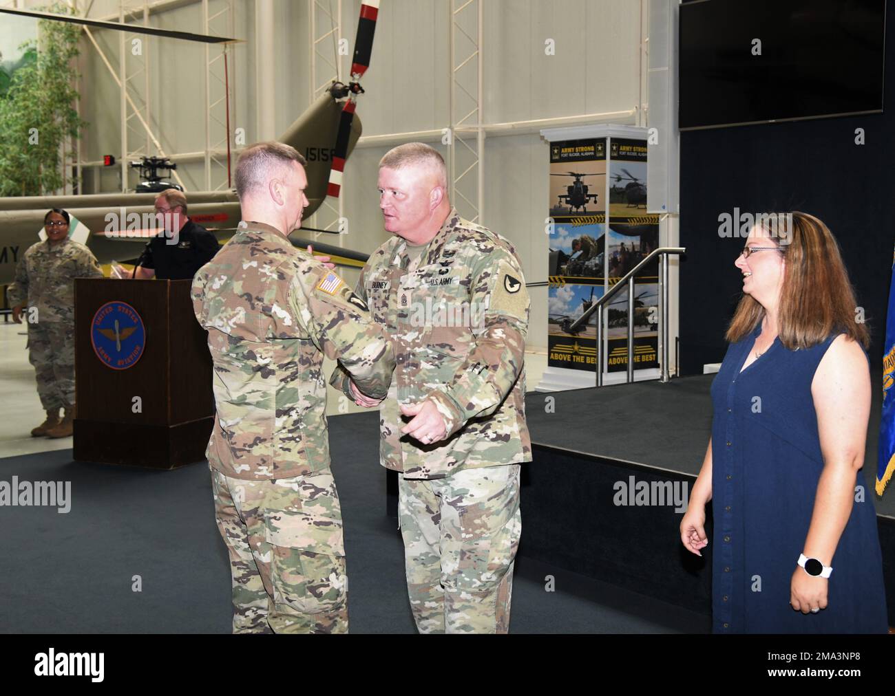 Maj. Gen. Todd Royar, U.S. Army Aviation and Missile Command commander, shakes hands with newly ...