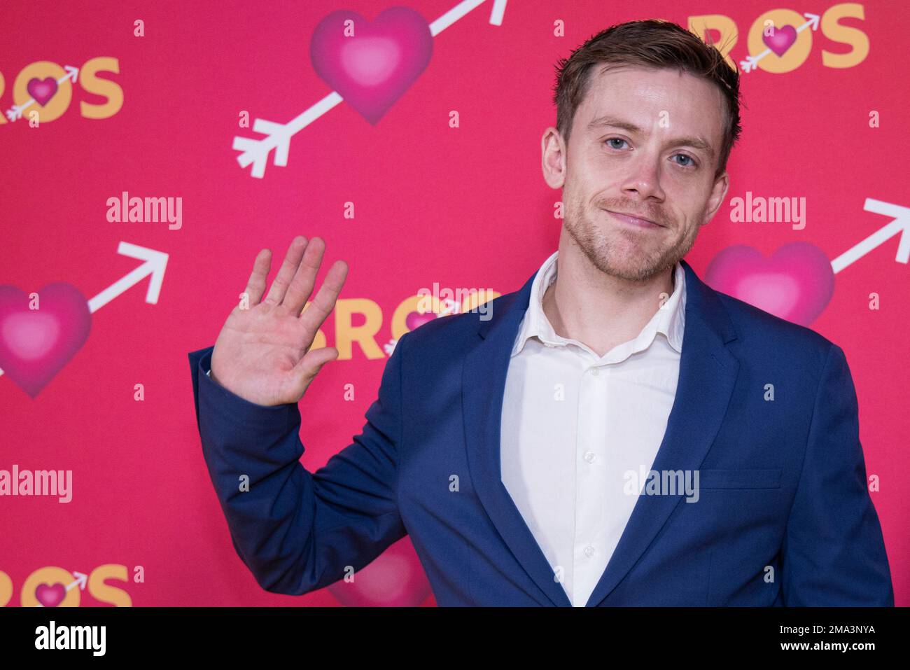 Owen Jones poses for photographers upon arrival for the premiere of the film 'Bros' in London ...