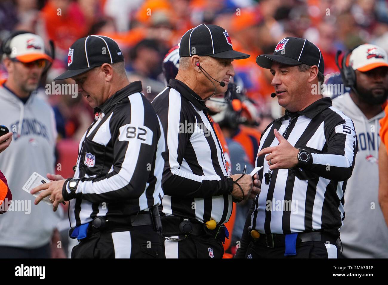 Umpire Bryan Neale (92) and field judge Joe Blubaugh (57) during the ...